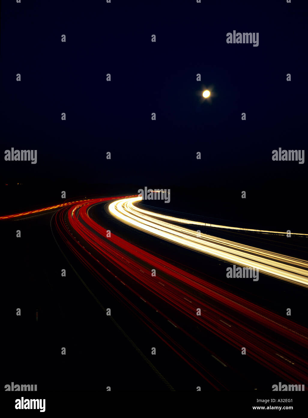 Night time long exposure of traffic light and moon M56 motorway ...