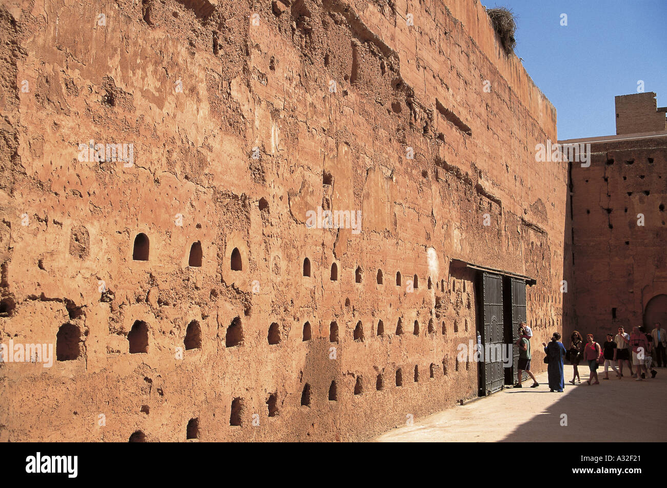 A tour group entering the historic El Badi Palace in Marrakech ...