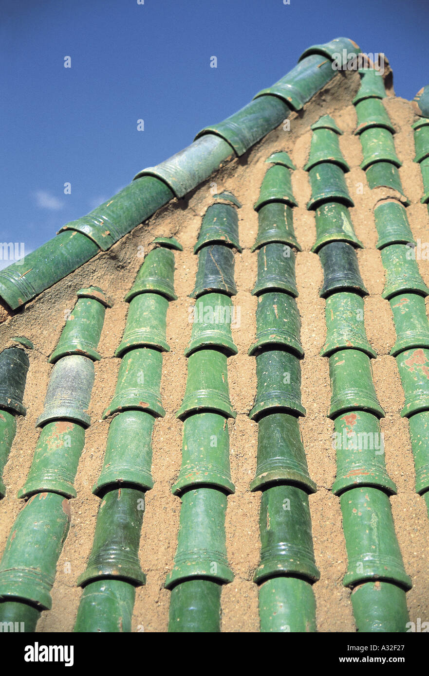 Detail of green, glazed roof tiles, traditional in Morocco, here on the ...