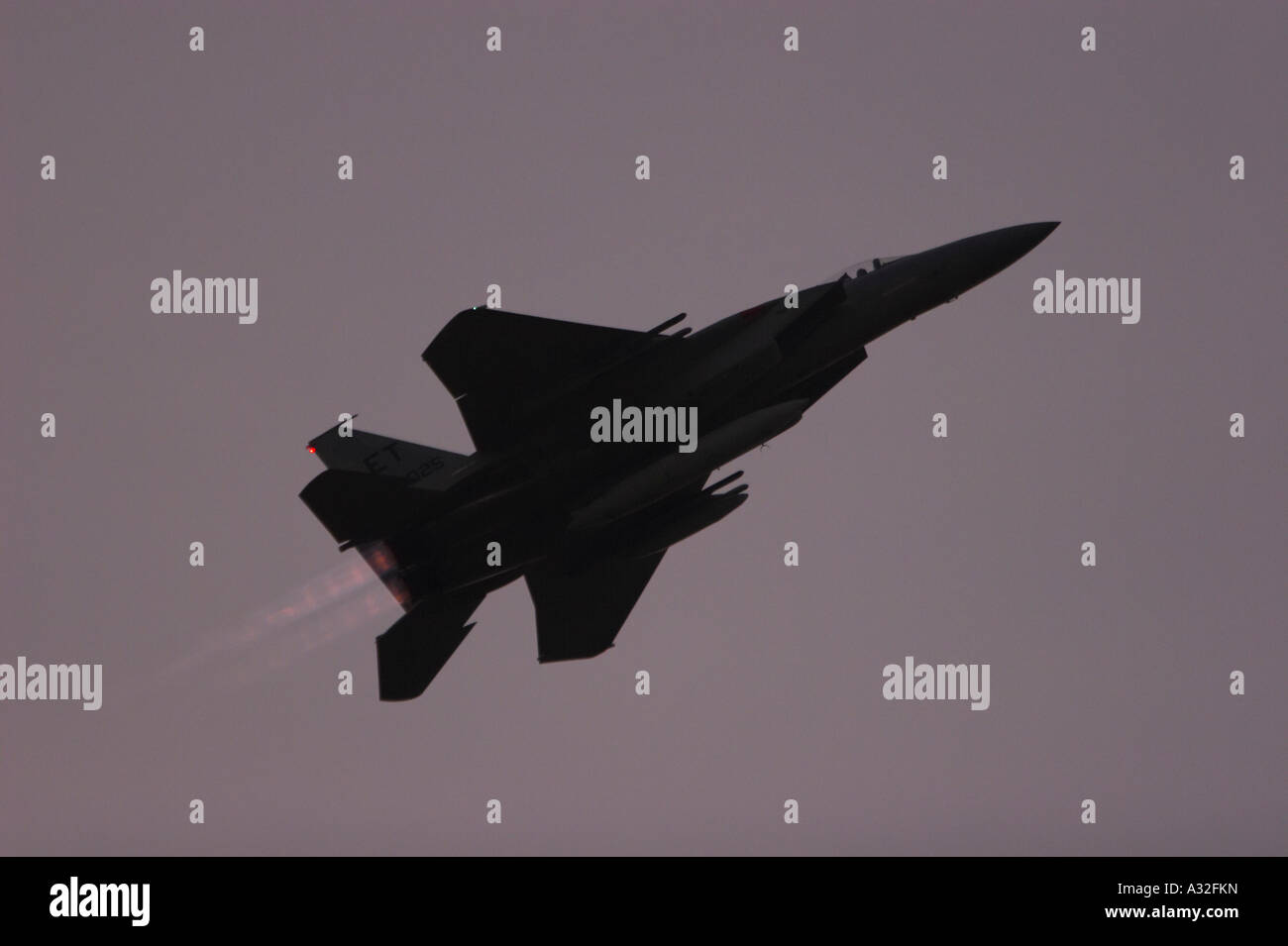 An F 15E Strike Eagle with afterburner on ascending into the sky after ...