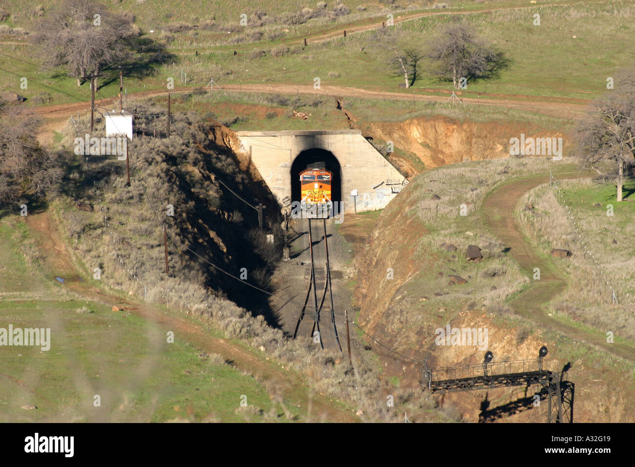 BNSF Freight Train emerges from a Tunnel at Tehachapi Loop California USA Stock Photo - Alamy