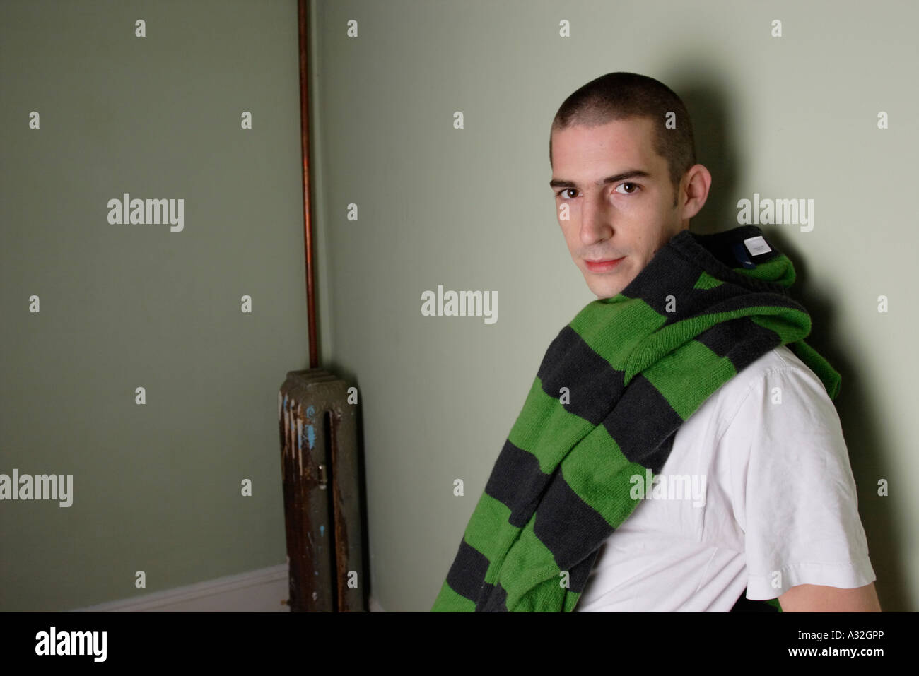 Young man in empty room Stock Photo - Alamy