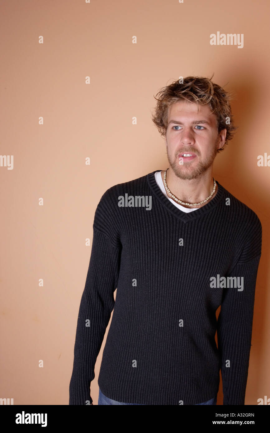 Man standing indoors Stock Photo - Alamy