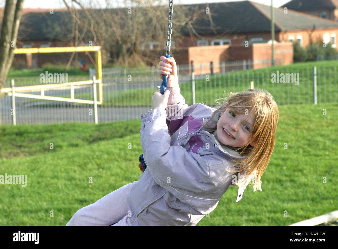 A girl on a climbing frame Stock Photo - Alamy