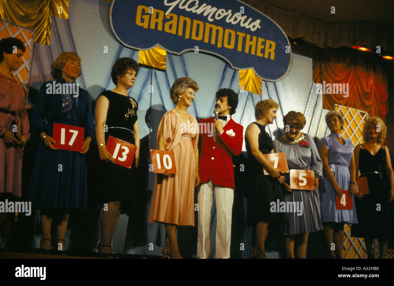glamorous grandnother competition host chatting with contestants on ...