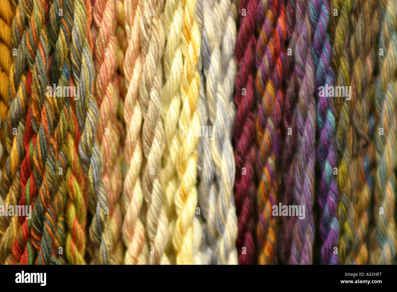 Different coloured wool hanging Stock Photo - Alamy