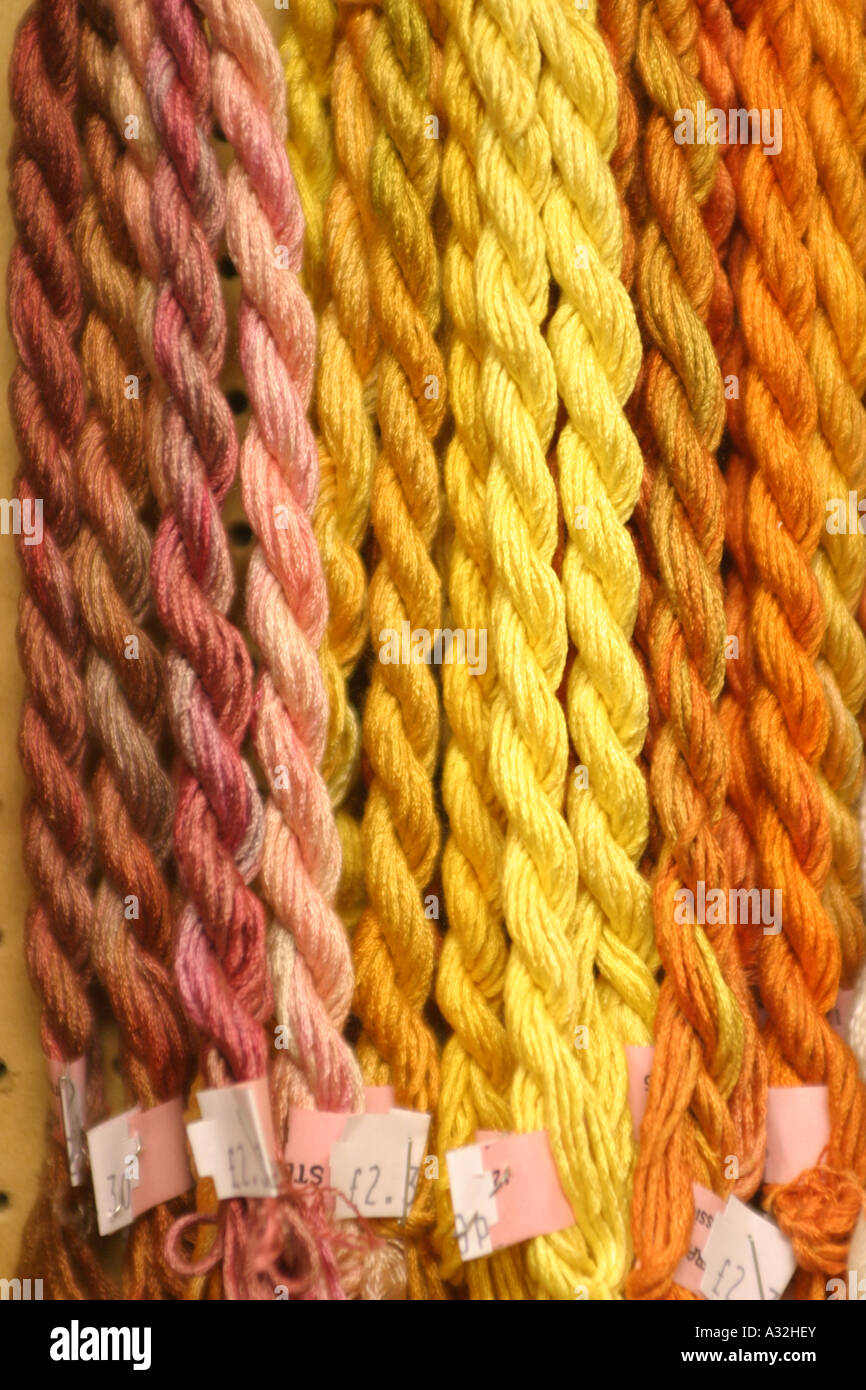 Different coloured wool hanging Stock Photo - Alamy