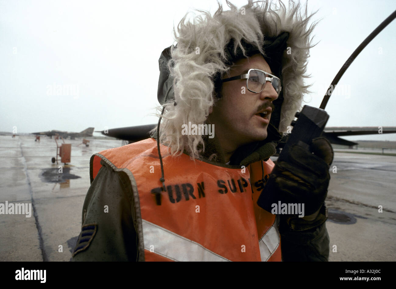 raf airbase ground crew supervisor talking on walkie talkie radio ...