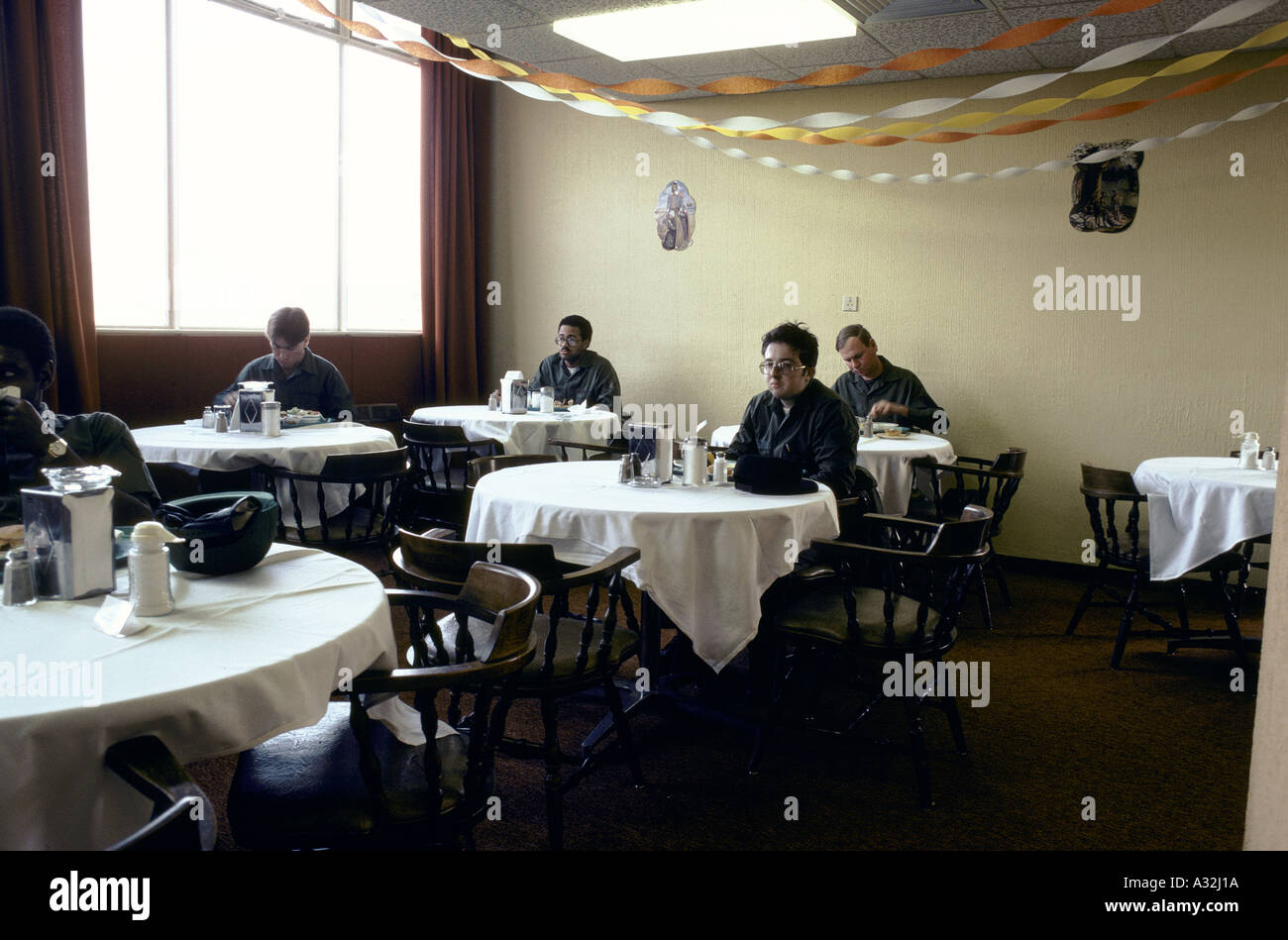 raf lakenheath usaf base servicemen sit alone at tables while eating ...