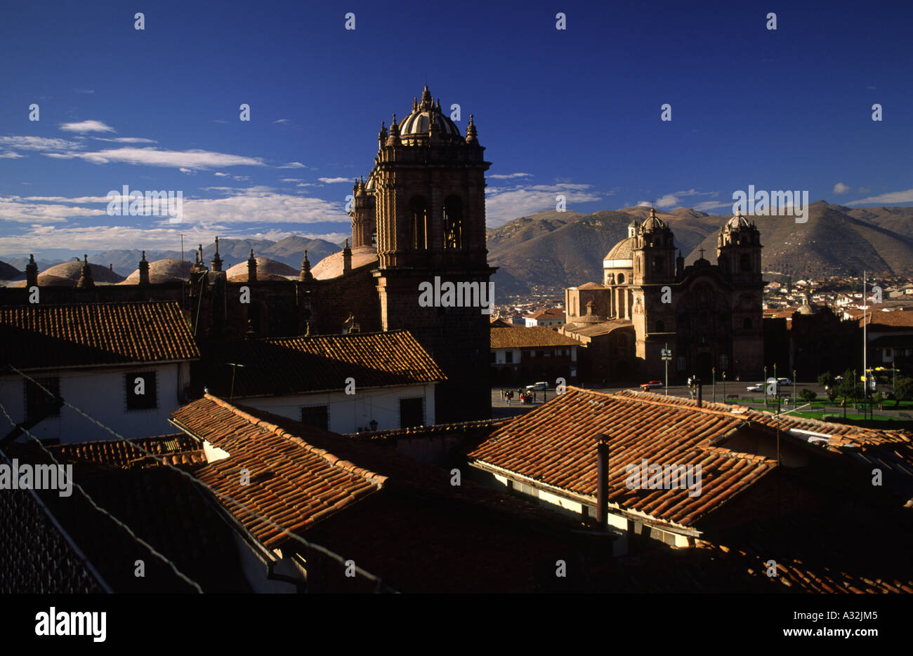 Horizontal landscape of Cusco buildings in main square with red roof ...