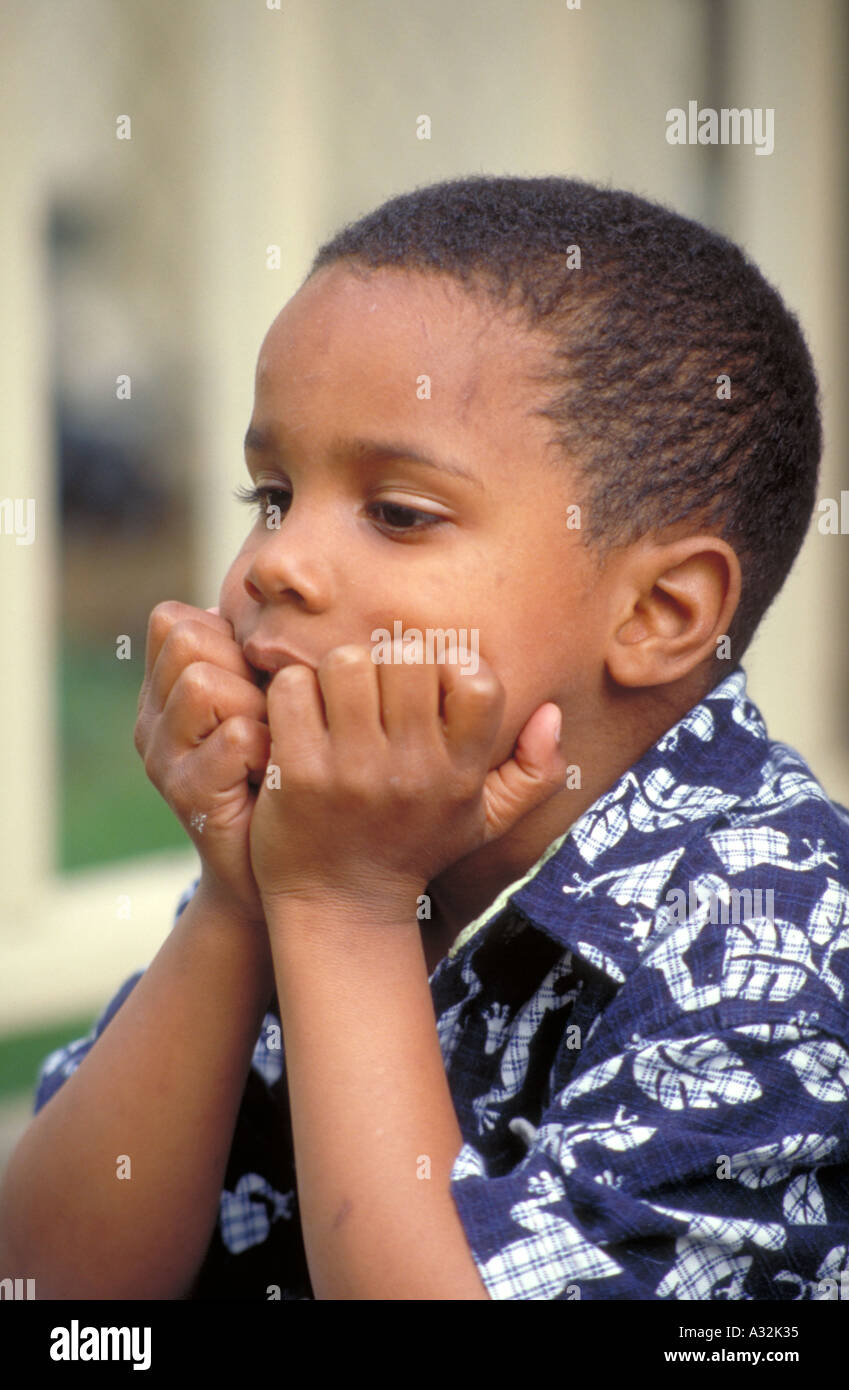 Pondering boy St Paul Minnesota Stock Photo - Alamy