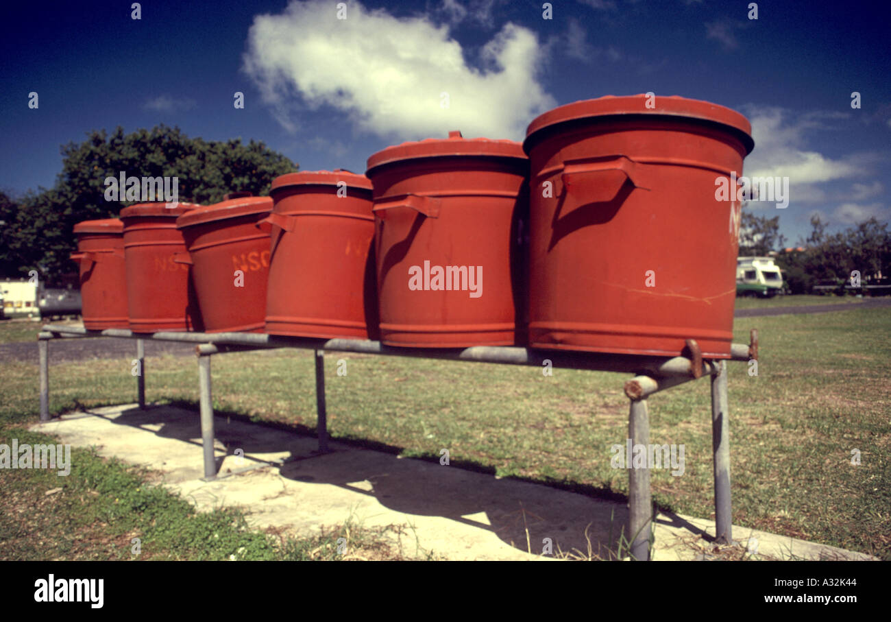 A ROW OF RUST RED GARBAGE BINS AGAINST A DARK BLUE SKY Stock Photo - Alamy