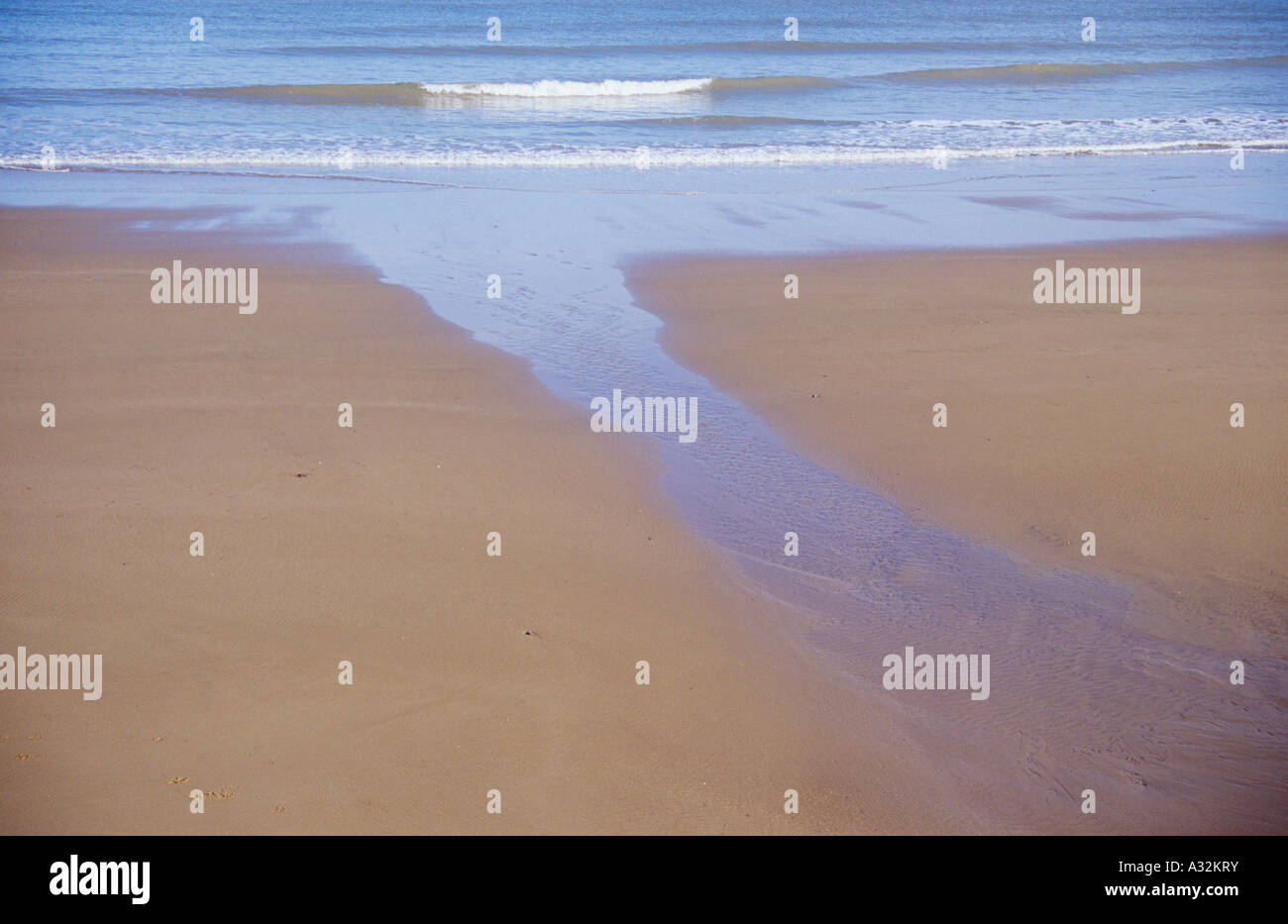 Sea rippling onto beach hi-res stock photography and images - Alamy