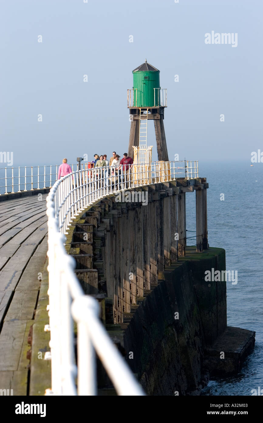 Green wooden beacon at end of west pier on whitby harbour in north ...
