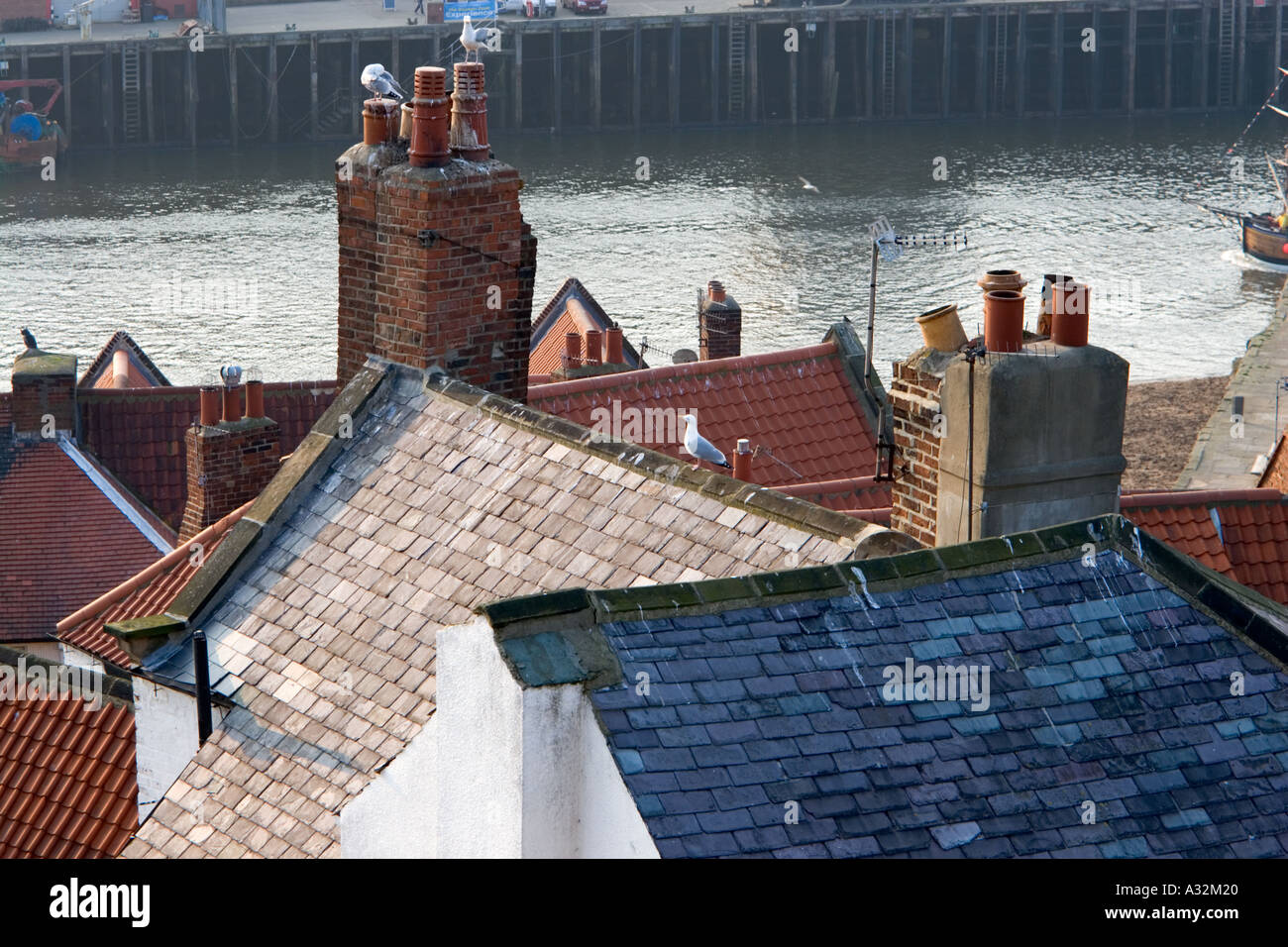 Slate roofs and tiled roofs, chimney stacks and chimney pots on House ...