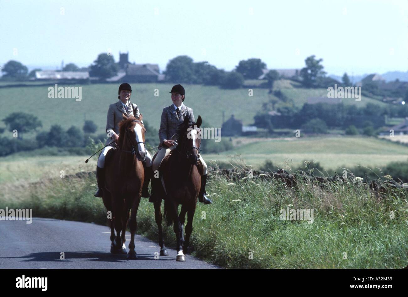 two horse riders in the english countryside Stock Photo - Alamy