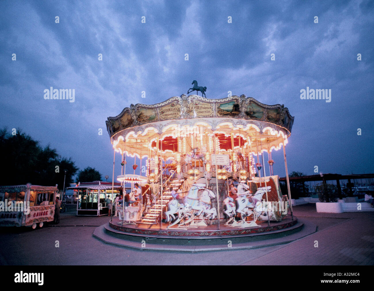 illuminated roundabout at fairground paris Stock Photo - Alamy