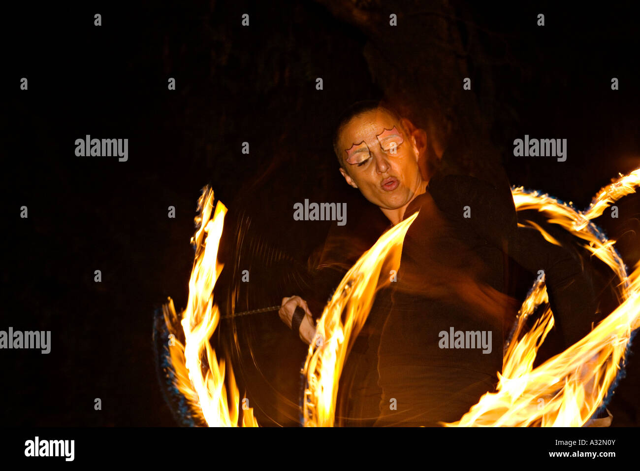 MEXICO San Miguel de Allende Woman fire dancing using poi circles of ...