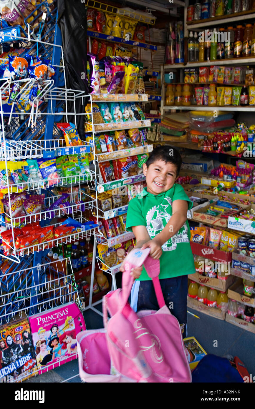 MEXICO San Miguel de Allende Young Mexican boy hold pink backpack and ...