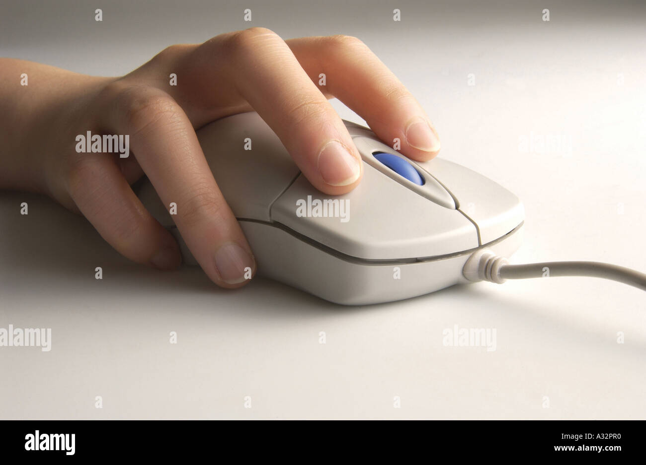 A right hand grabbing a mouse viewed from the front Stock Photo - Alamy