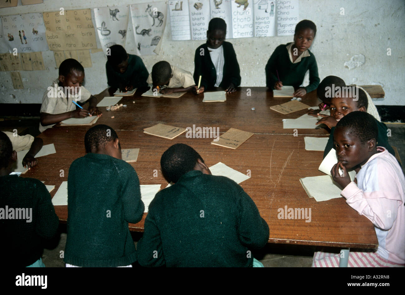 Primary children working in classroom Zimbabwe Stock Photo - Alamy