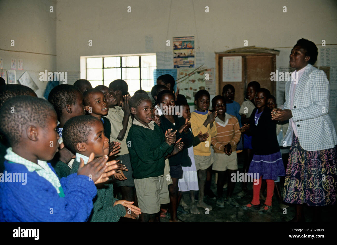 Primary children and teacher in their classroom Zimbabwe Stock Photo ...