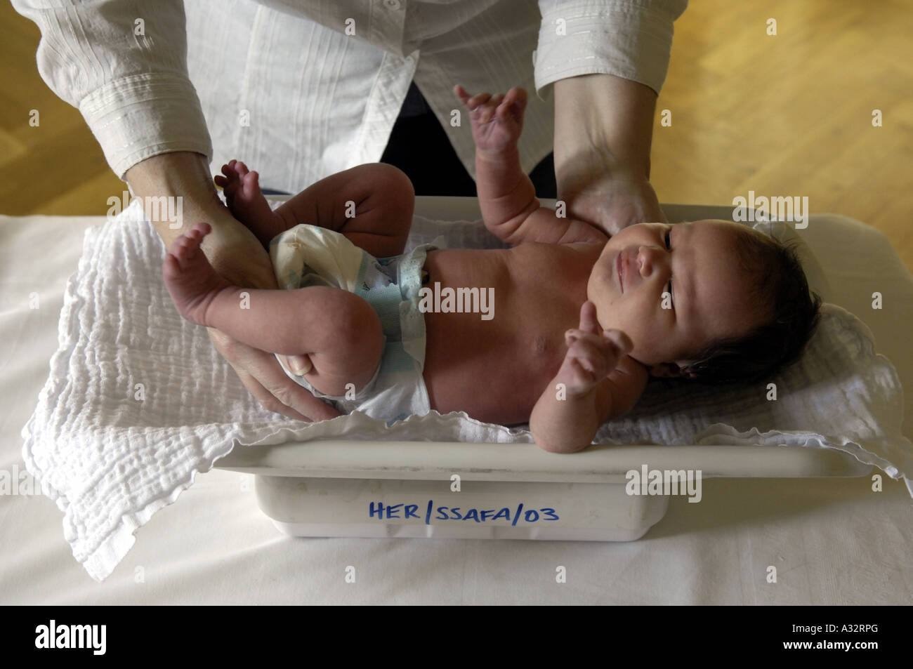 Baby weight scales nappy hi-res stock photography and images - Alamy