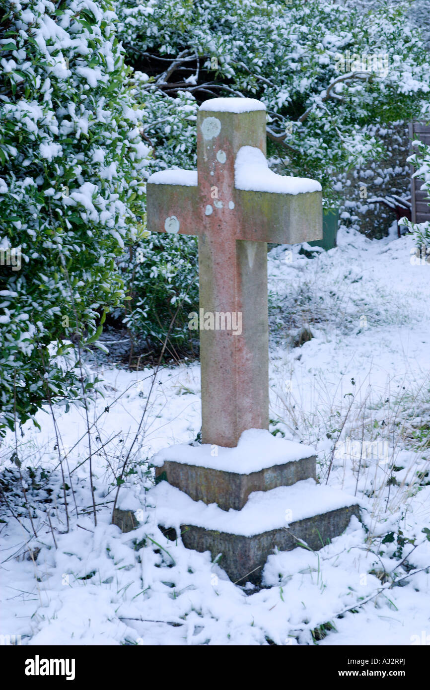 Snow covered Cross Headstone in the churchyard of St Marys Parish ...