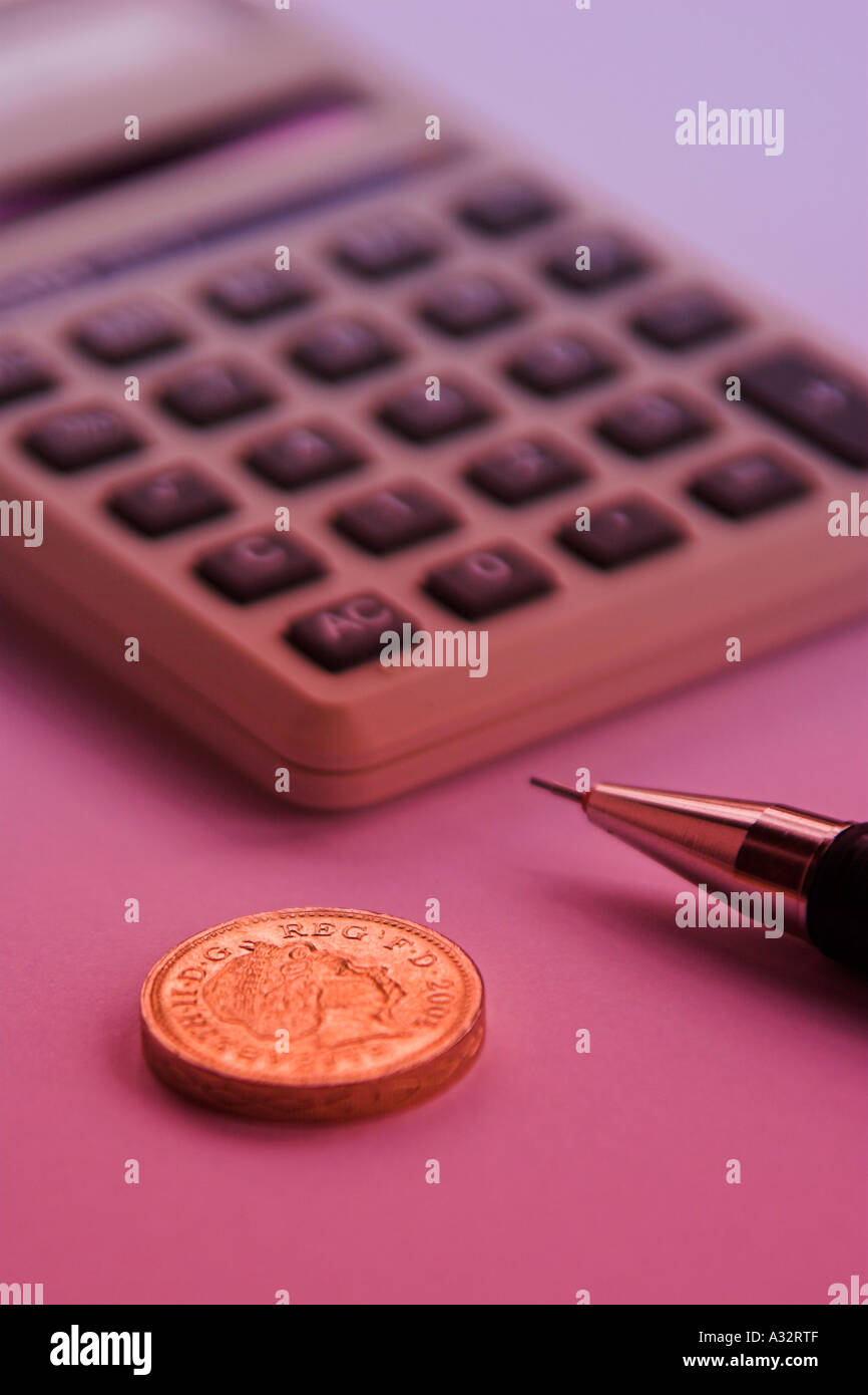 Concept image of a calculator, coin, and pen / pencil Stock Photo - Alamy