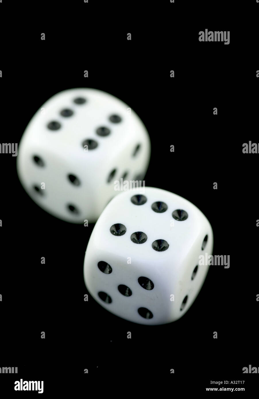 two dice being thrown Stock Photo - Alamy