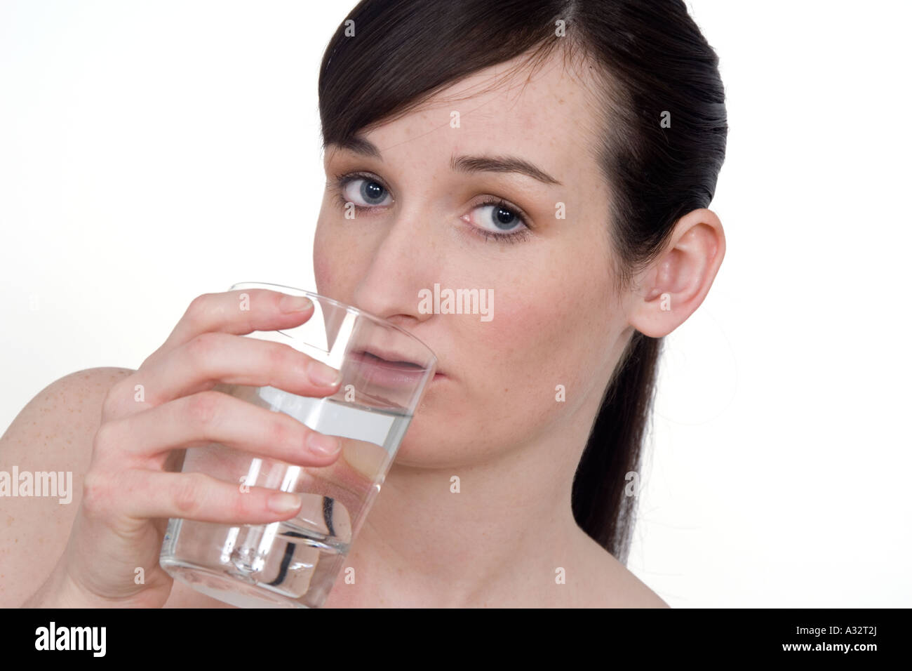 young woman drinking a glass of water Stock Photo - Alamy