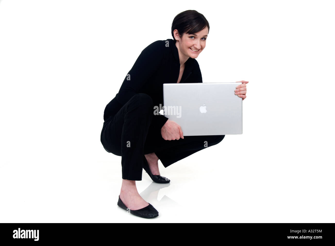 girl holding a laptop computer Stock Photo - Alamy