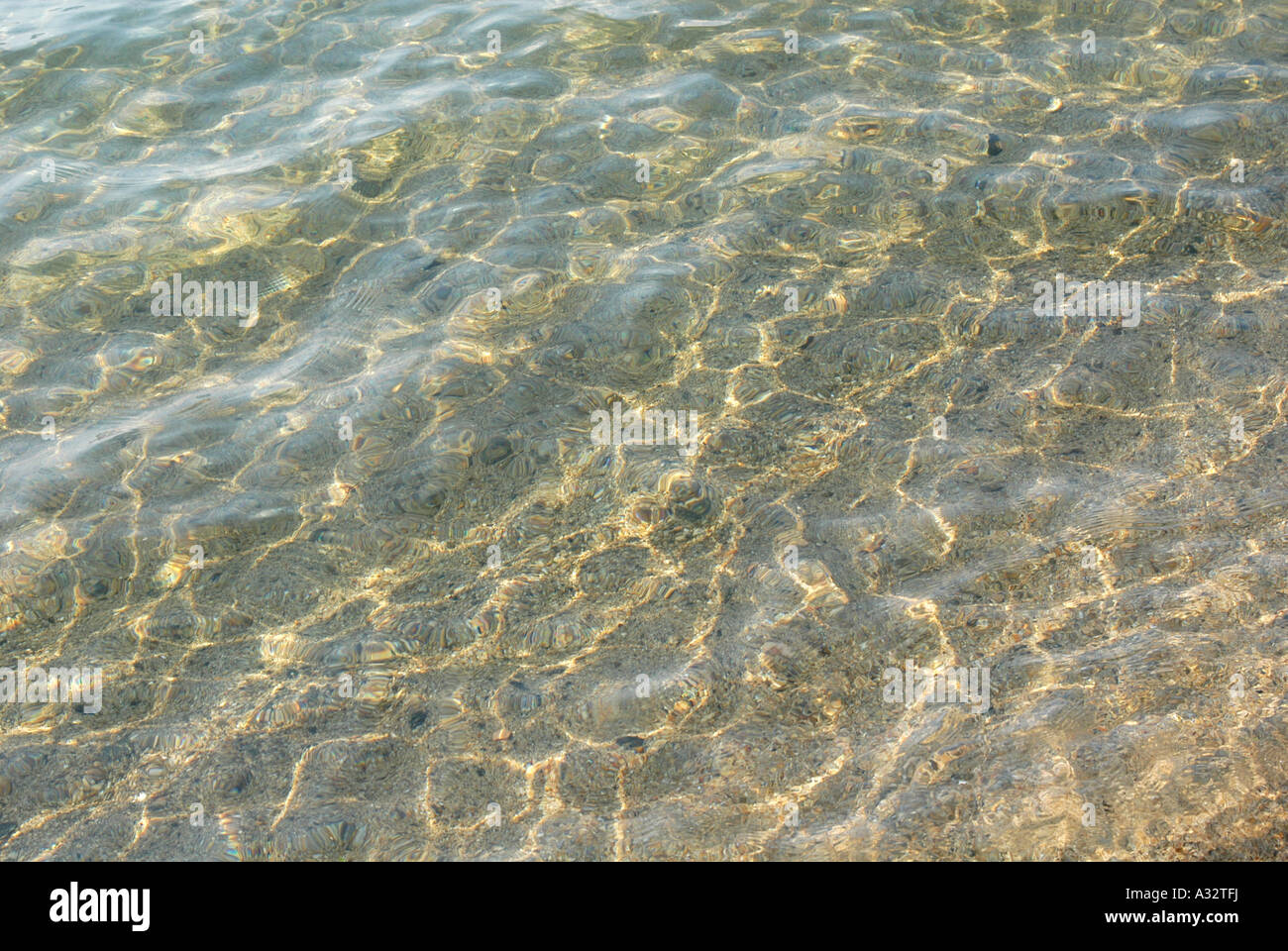 Sandy bottom through the clear water on Lake Baikal in Siberia, Russia ...