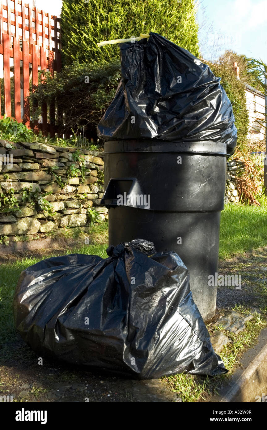 rubbish on the roadside ready for collection Stock Photo - Alamy