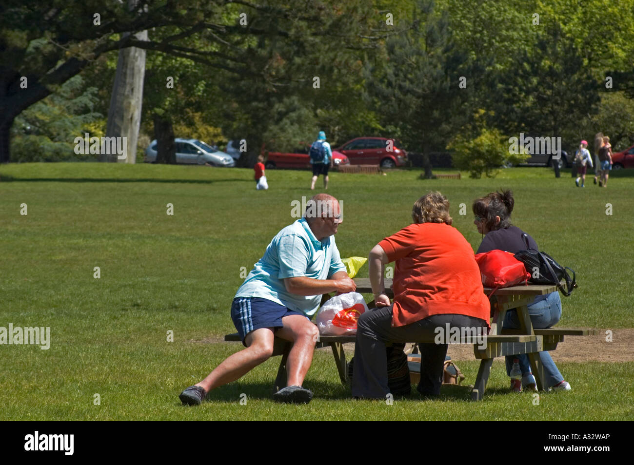 Chatting on bench hi-res stock photography and images - Alamy