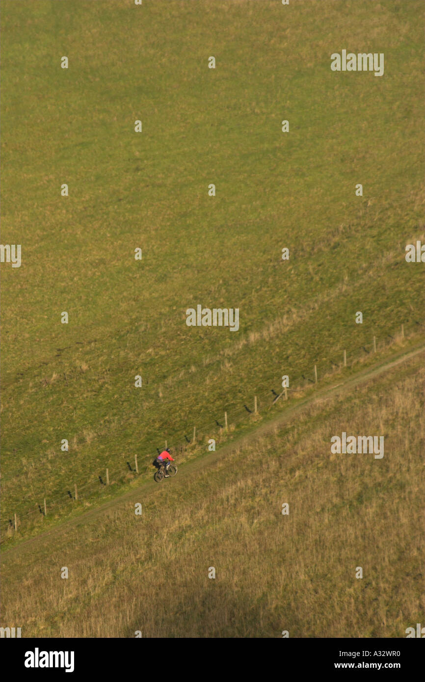 Cyclist on a downland pathway in Southern England Stock Photo - Alamy