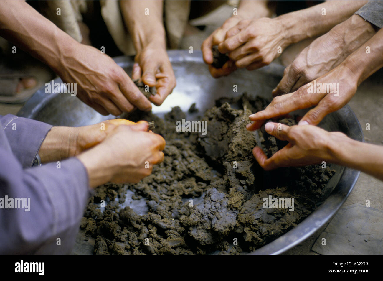 Cannabis resin: Hands kneading in a hash factory, North West Frontier ...