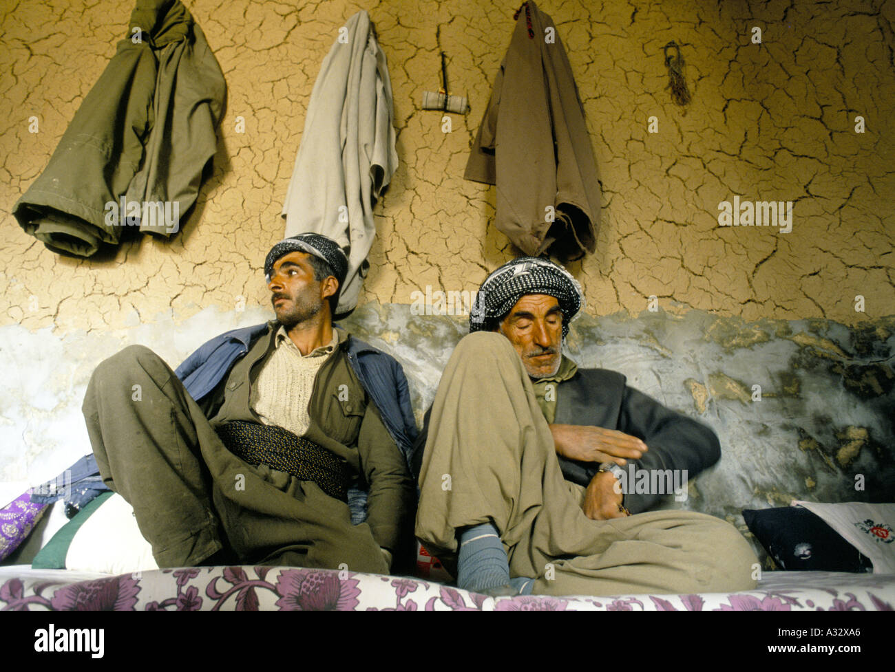 Time, two men sitting in a mud built house, Kurdistan, Iraq Stock Photo ...