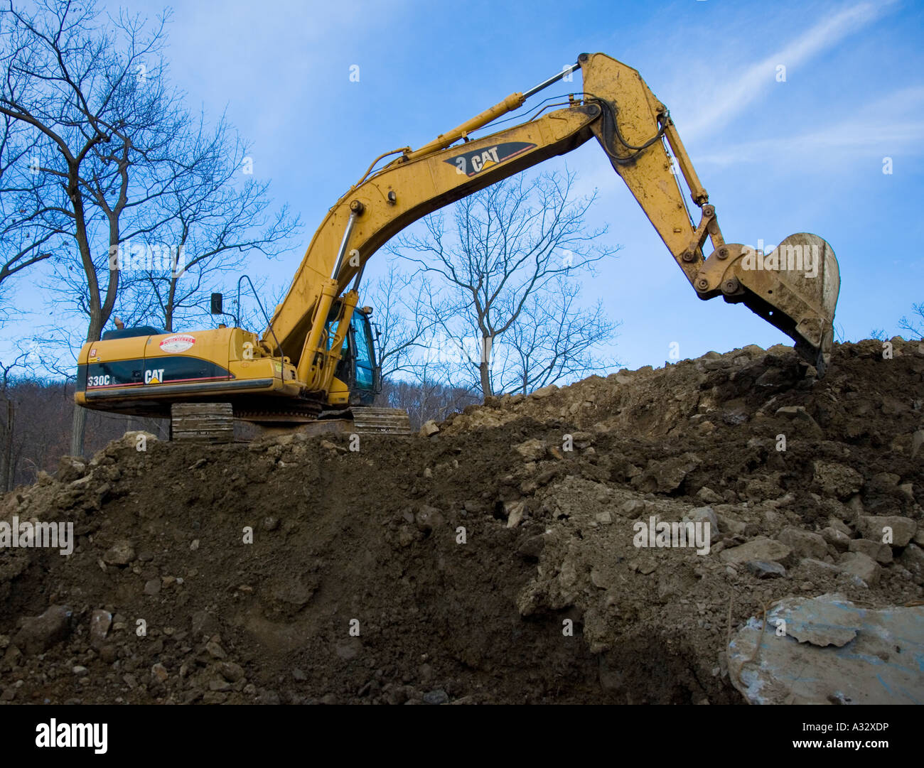 Backhoe dumping dirt hi-res stock photography and images - Alamy