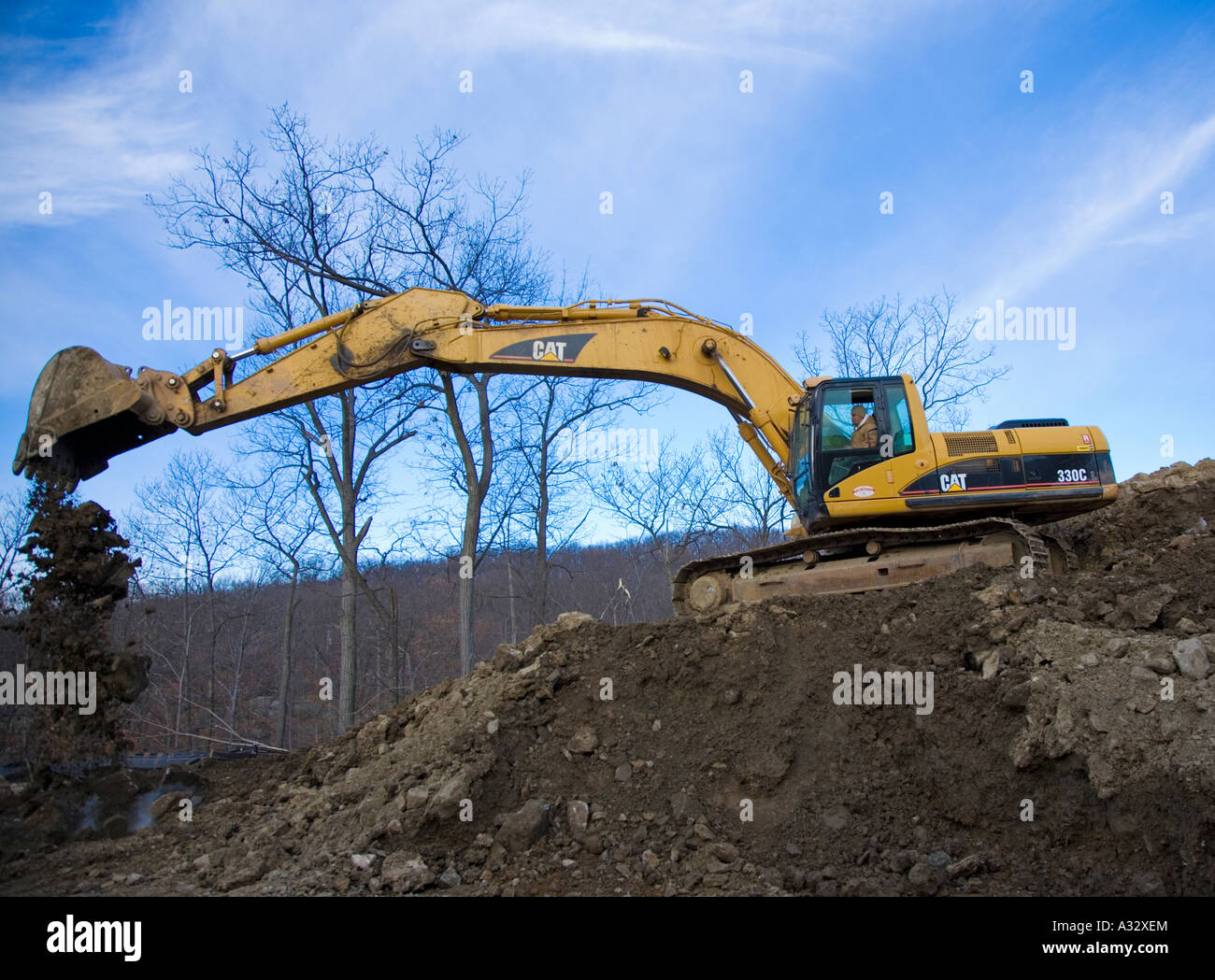 A backhoe at a construction site Stock Photo - Alamy
