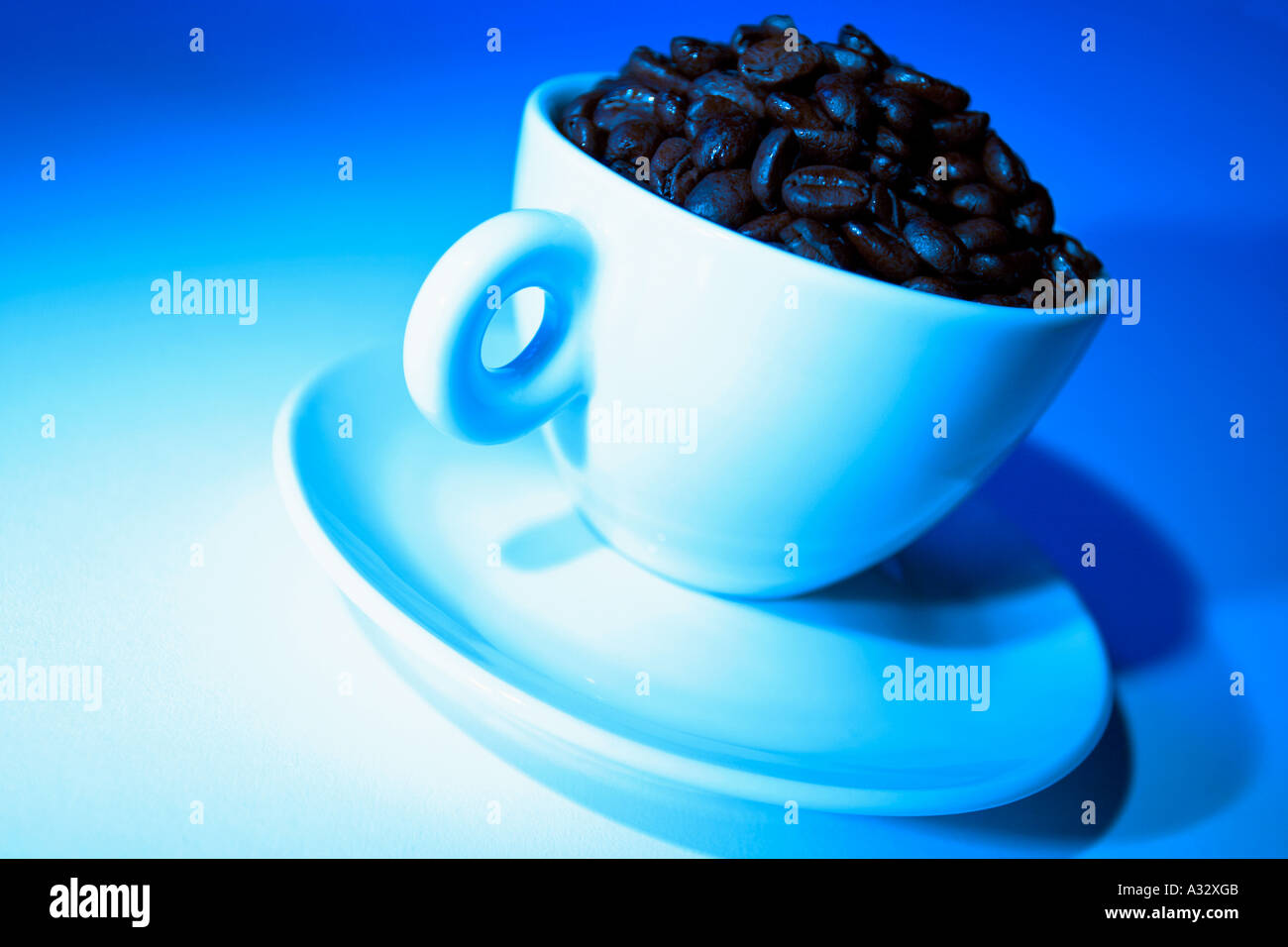 Cappuccino coffee cup full of coffee beans Stock Photo - Alamy