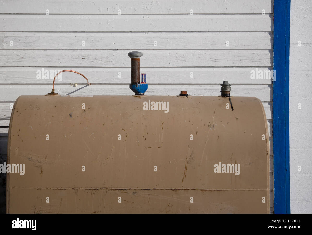 Storage tank on the side of a building Stock Photo - Alamy