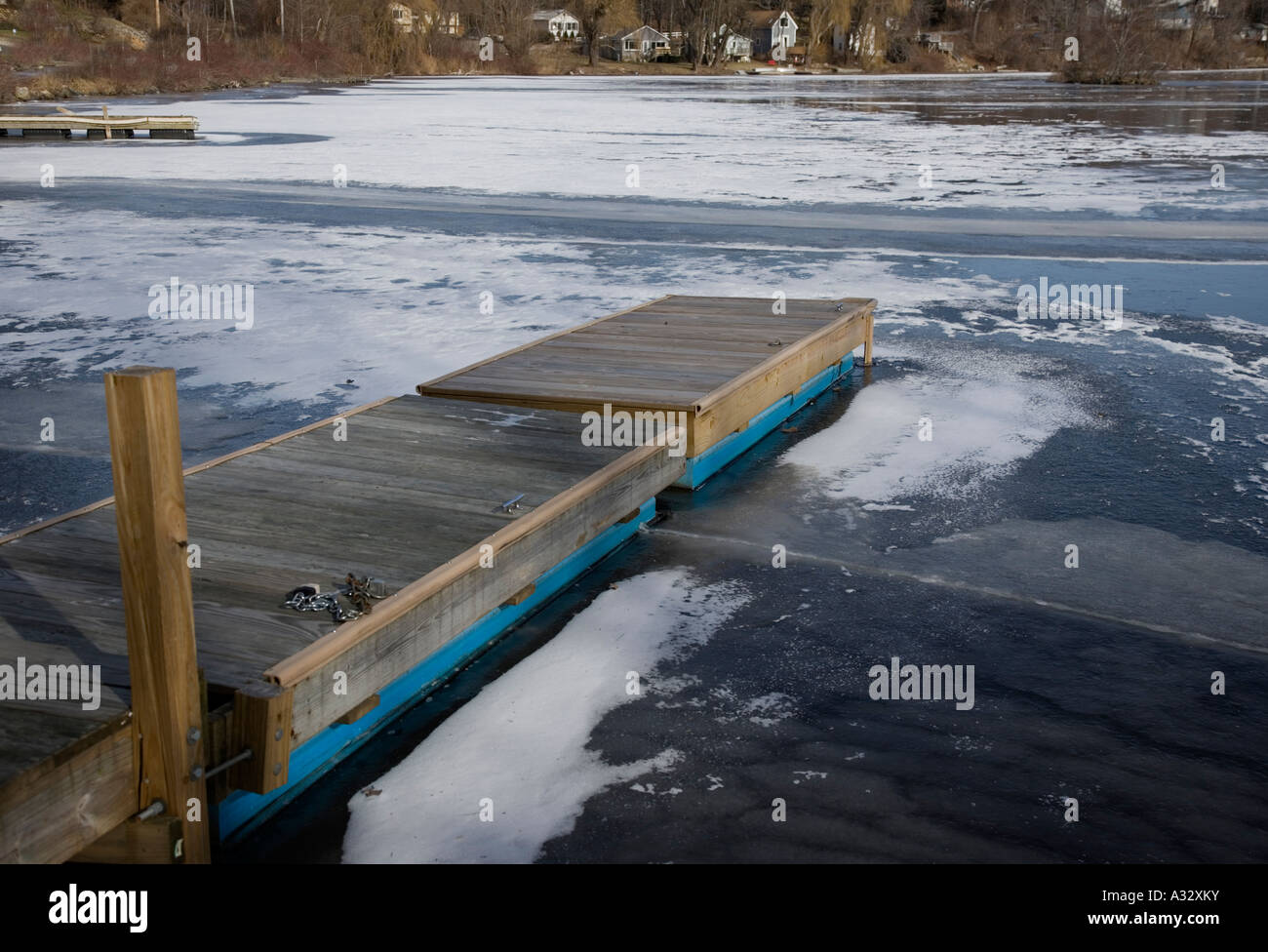 Dock on a frozen lake Stock Photo - Alamy