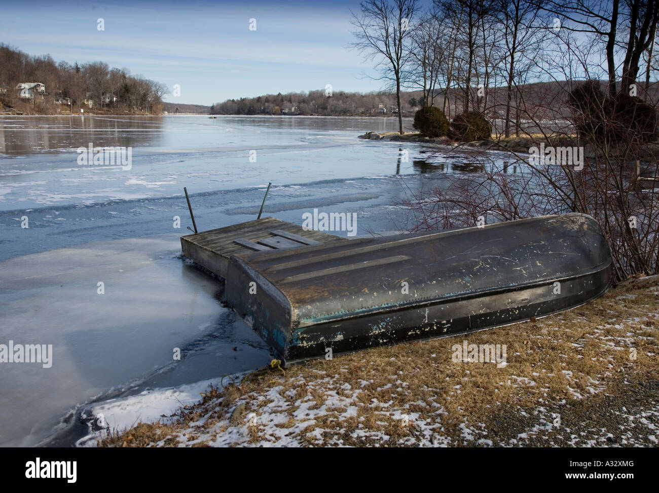 Dock on a frozen lake Stock Photo - Alamy