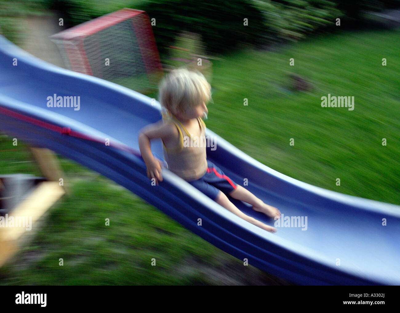 A sliding child Stock Photo - Alamy