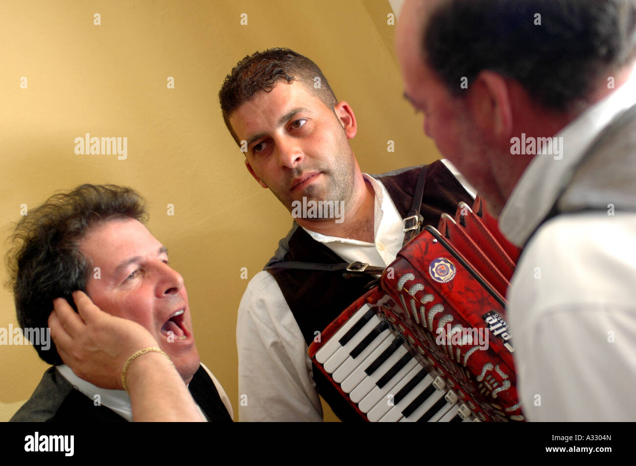 Men playing and singing traditional Sardinian songs Sardinia Italy ...