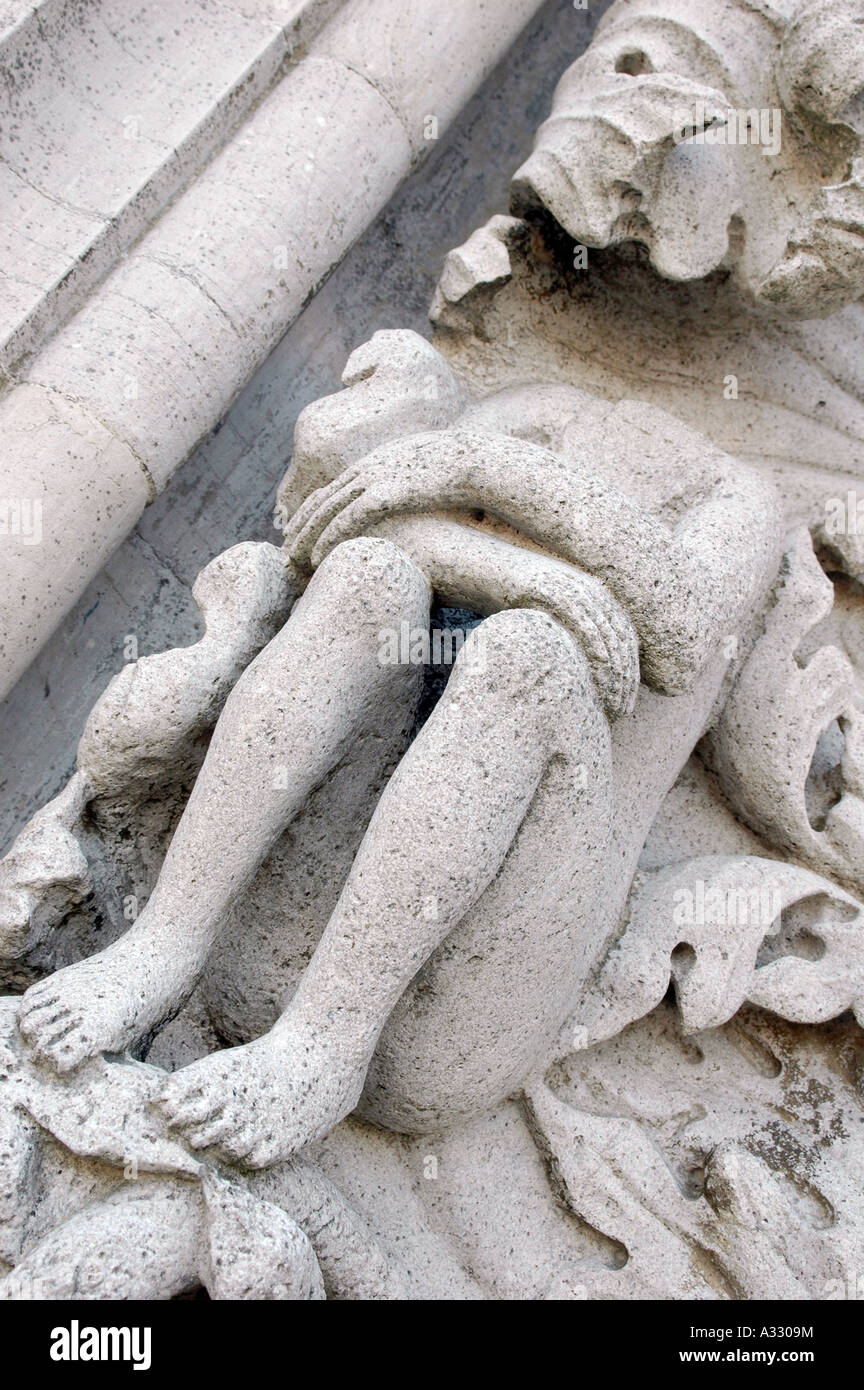 Detail of headless human figure portal Church of San Fortunato Todi ...