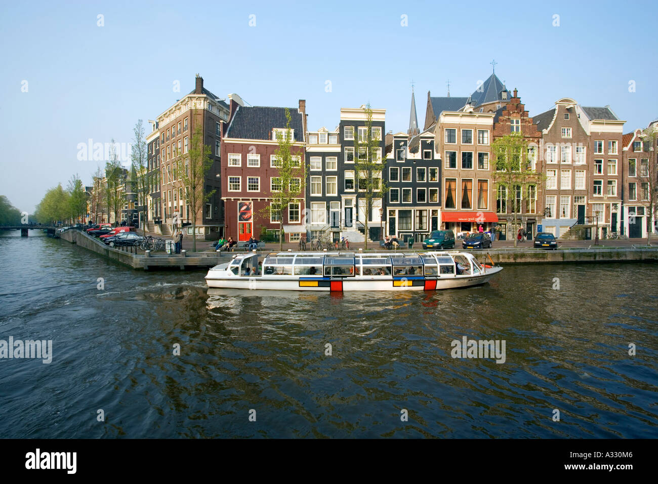 Amsterdam canal scene with city in background. Netherlands, Europe ...