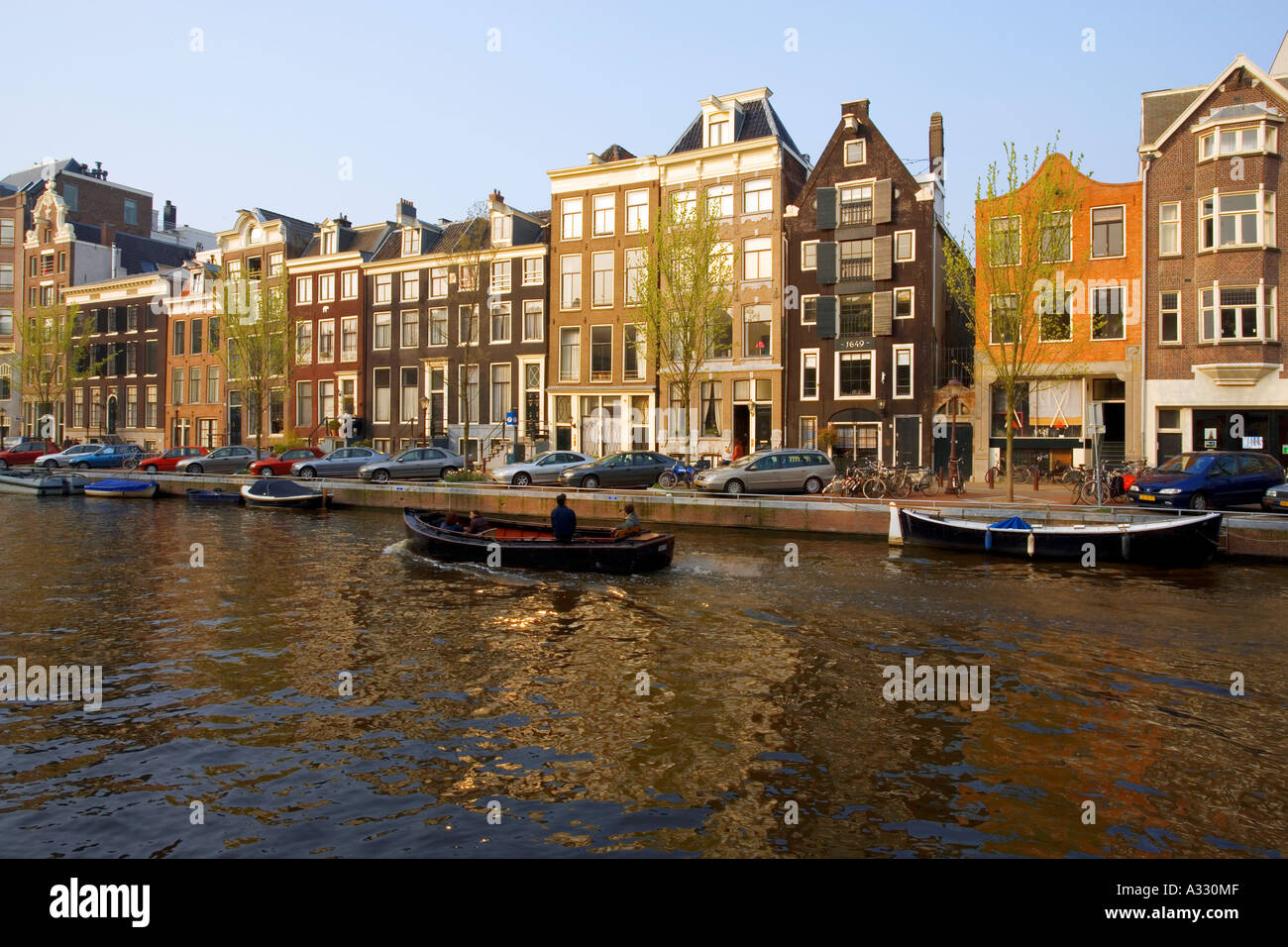 Amsterdam canal scene with city in background. Netherlands, Europe ...