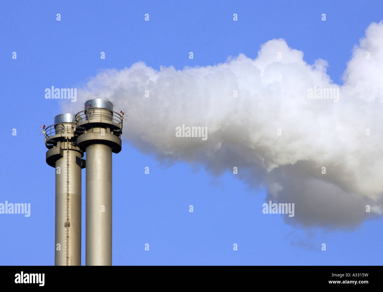 Smokestacks at a cogeneration plant Stock Photo - Alamy